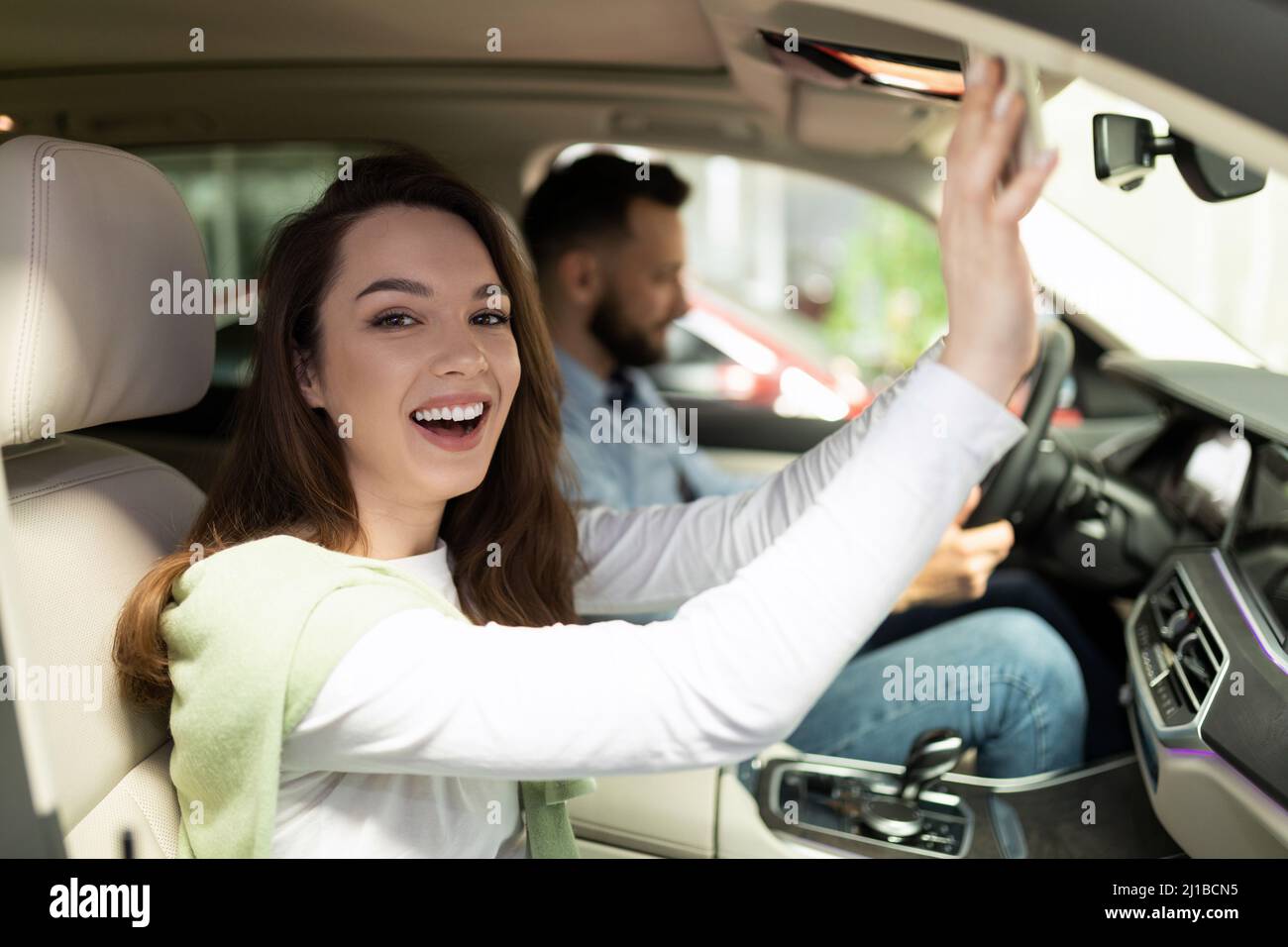 happy married couple just bought new cars in car dealership Stock Photo ...