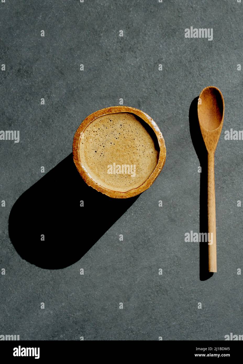 Top down view of coffee cup on dark textured background Stock Photo - Alamy