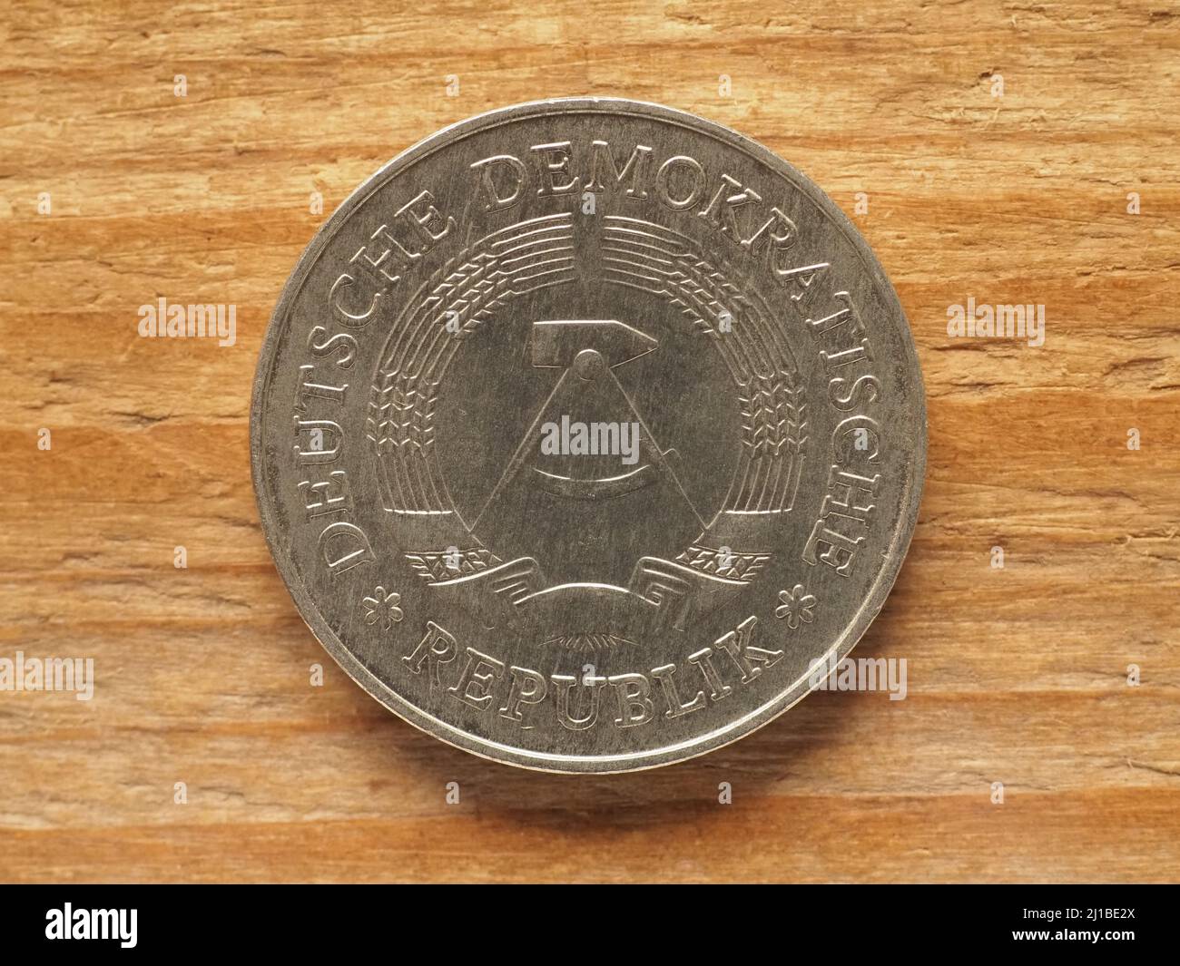 currency of East Germany, one mark coin obverse showing DDR emblem ...