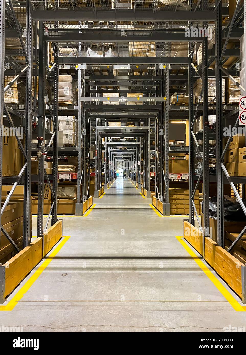 warehouse of goods in the store, racks with boxes. Furniture sales ...