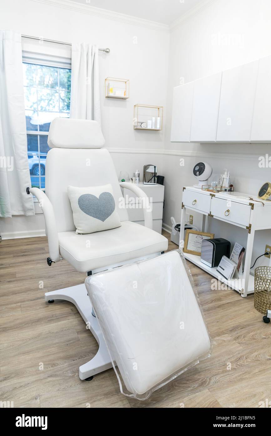 A medical spa patient room that is empty with a heart pillow on the ...