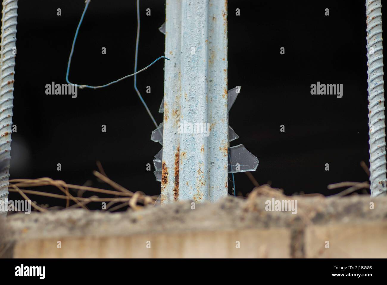 old broken window and white metal grill with rust Stock Photo - Alamy