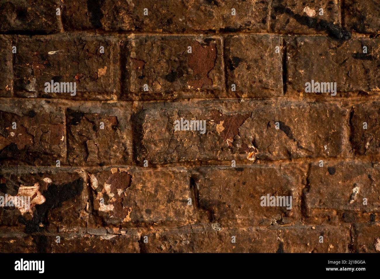 dark, dirty burnt wall, old brick, next to the stove Stock Photo - Alamy
