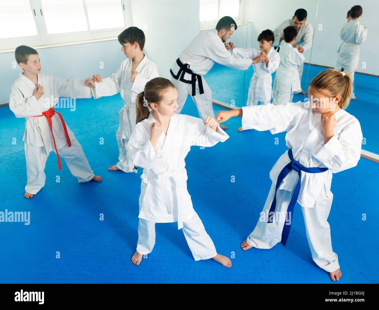 Children training in pairs Stock Photo - Alamy