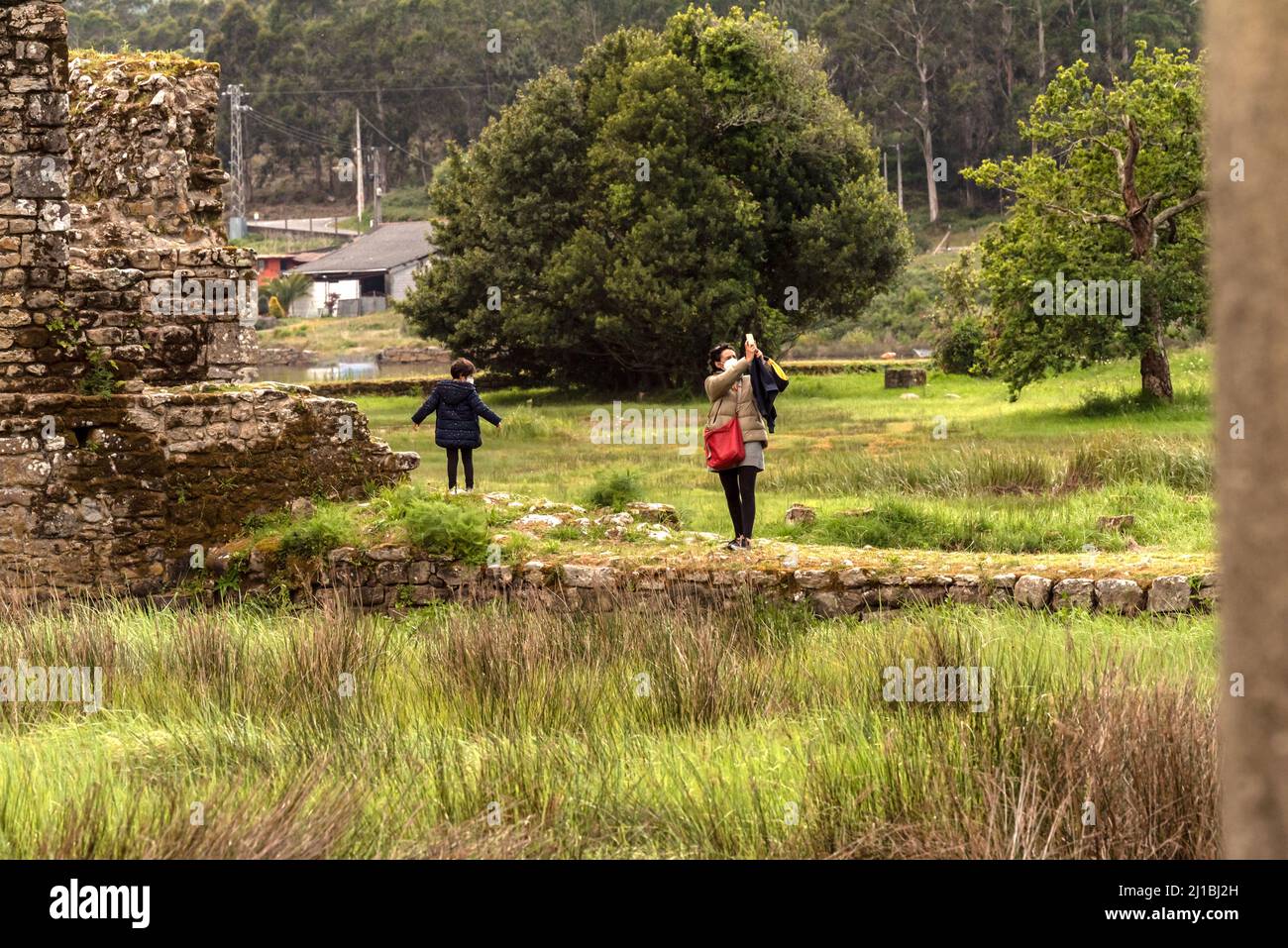 family visit ruins of ancient defensive towers on a cloudy day Stock ...