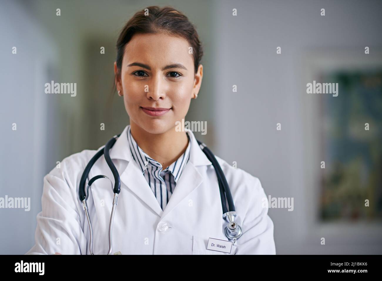 Dedicated to doctoring. Portrait of a confident young doctor at work ...