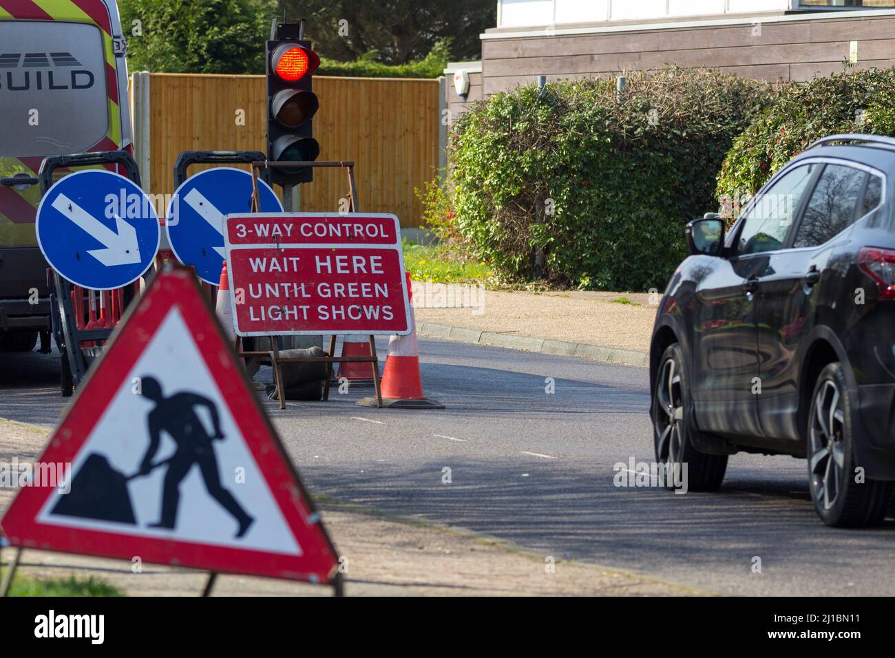 Traffic light control at roadworks 3 way system, men at work sign ...