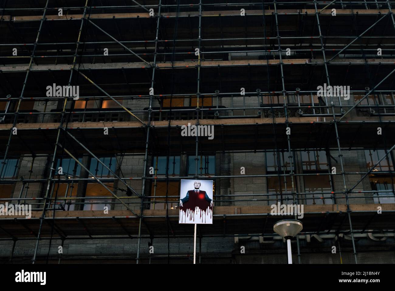 A poster condemns Putin and his war in Ukraine, as seen on a street in ...