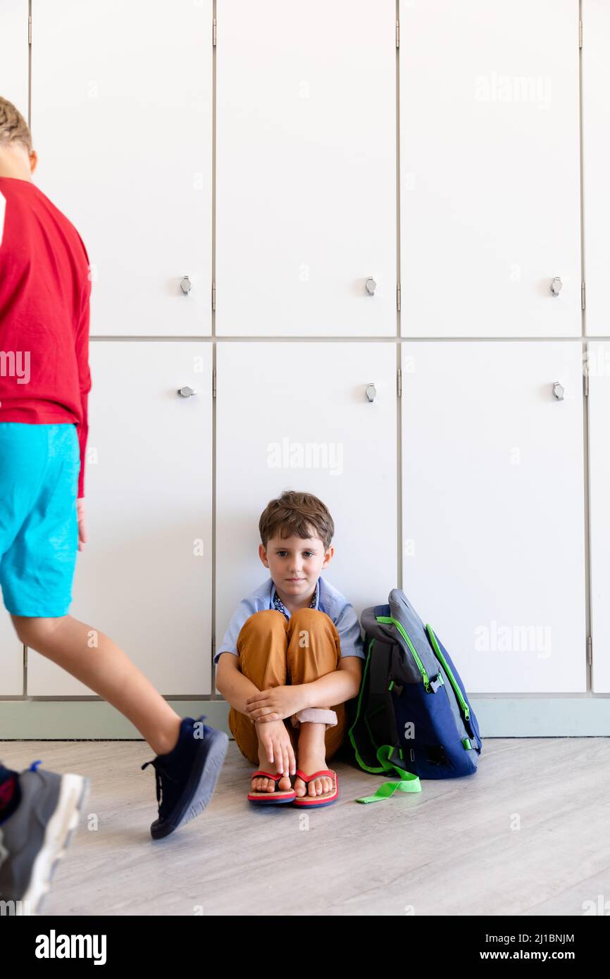 Student hugging knees classroom hi-res stock photography and images - Alamy