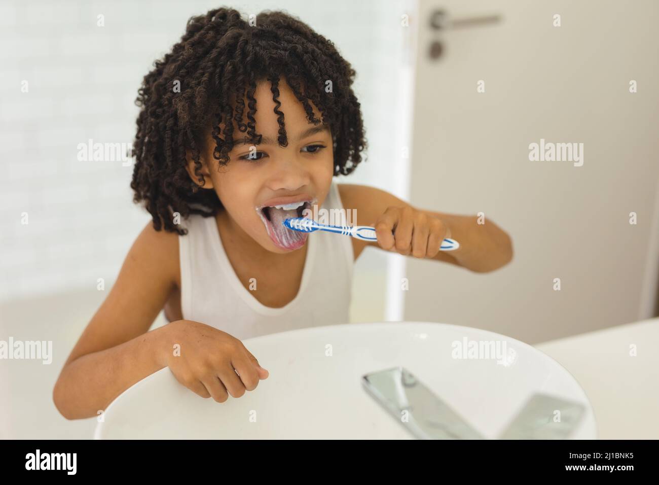 Hispanic Child Brushing Teeth