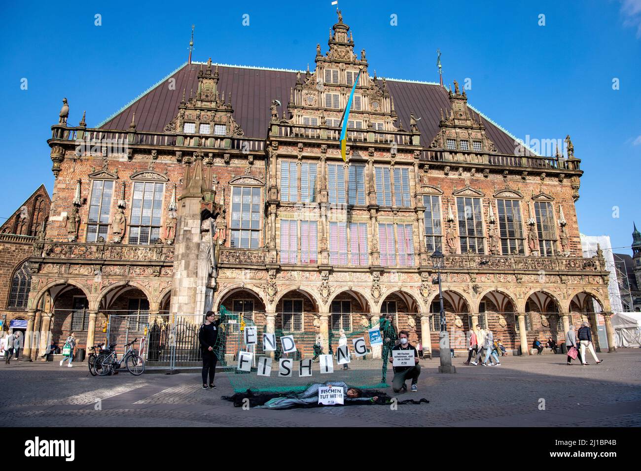 Bremen, Germany. 24th Mar, 2022. PETA activists dressed up as fish and ...