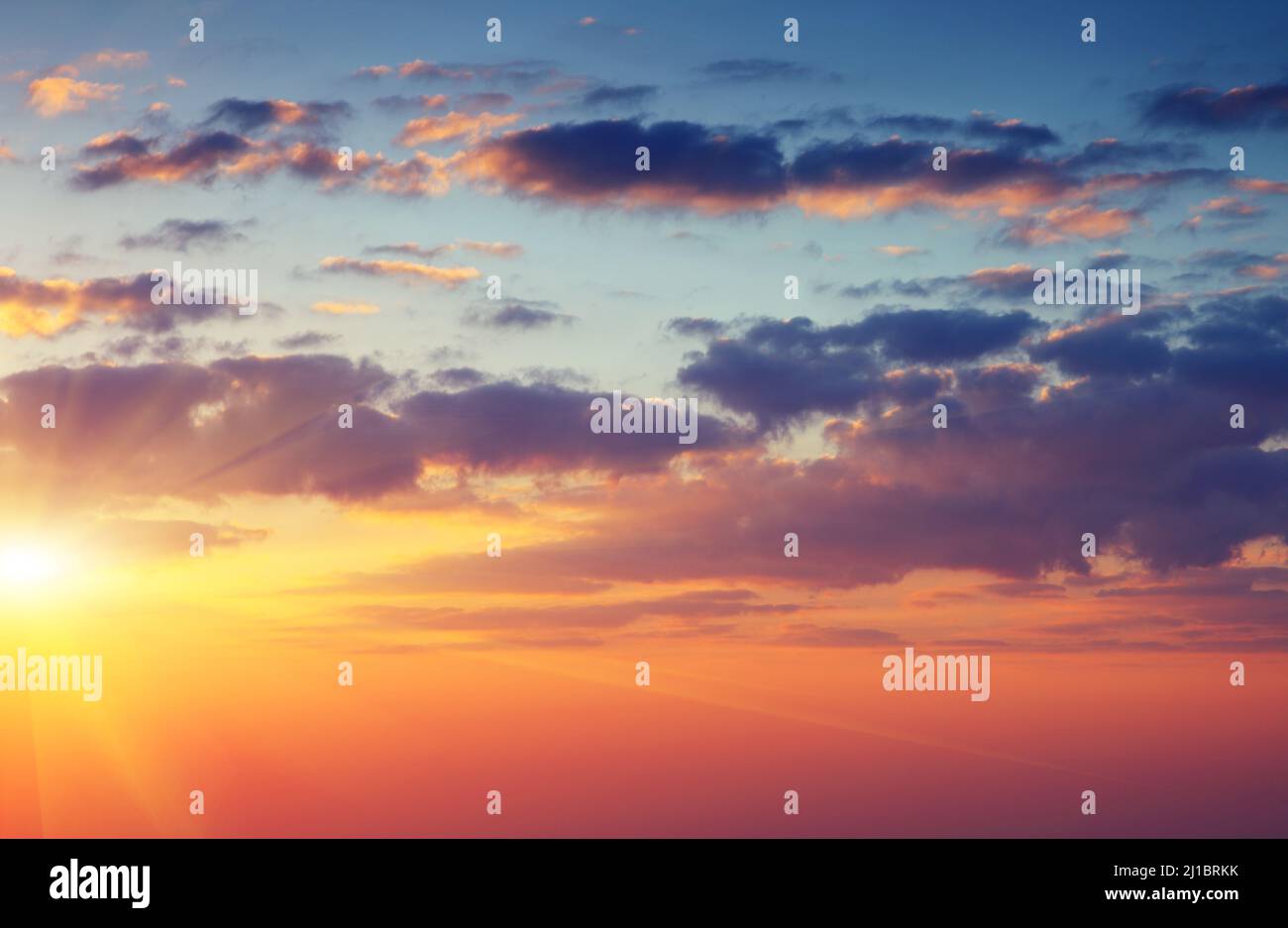 Dramatic sunset sky with clouds glowing red Stock Photo - Alamy