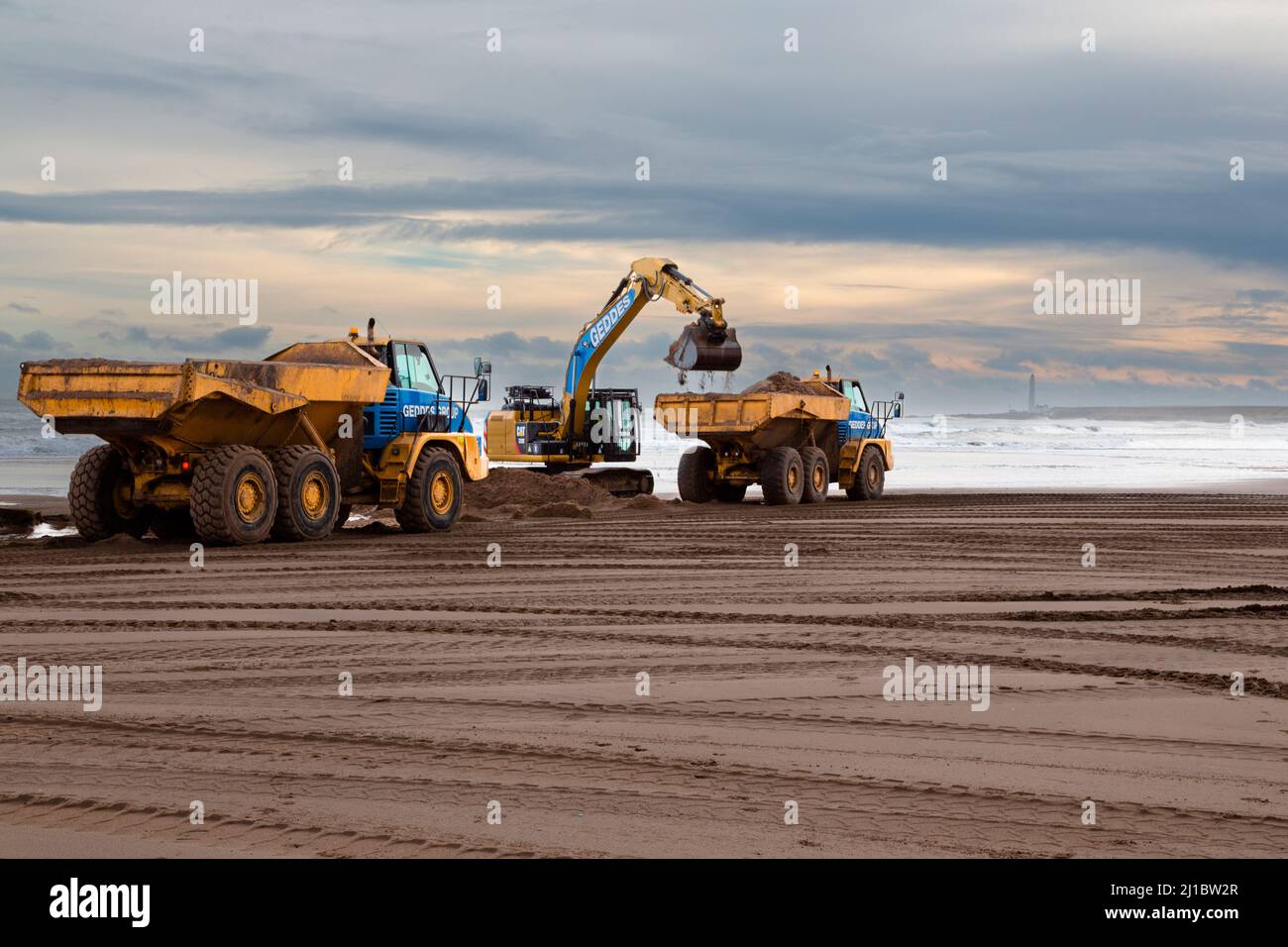 Digger and lorries on Montrose beach in Scotland as part of works to ...