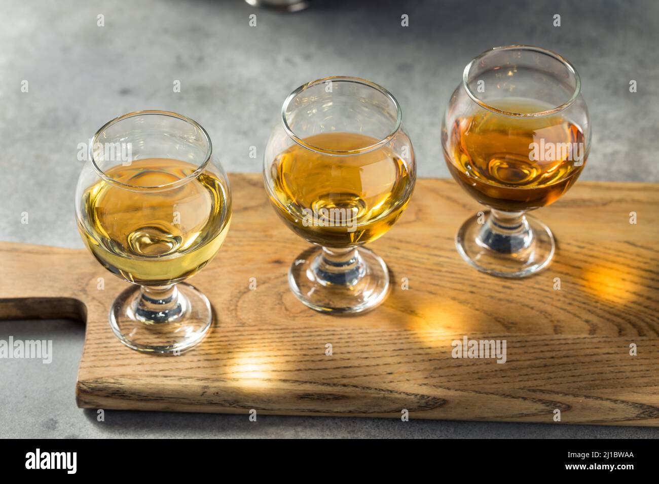 Boozy Smokey Whiskey Flight in Three Glasses Stock Photo - Alamy