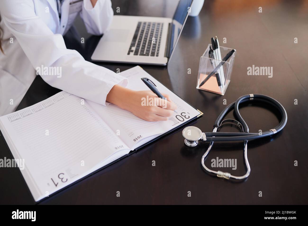 Lets get you in here asap. High angle shot of an unrecognizable female ...