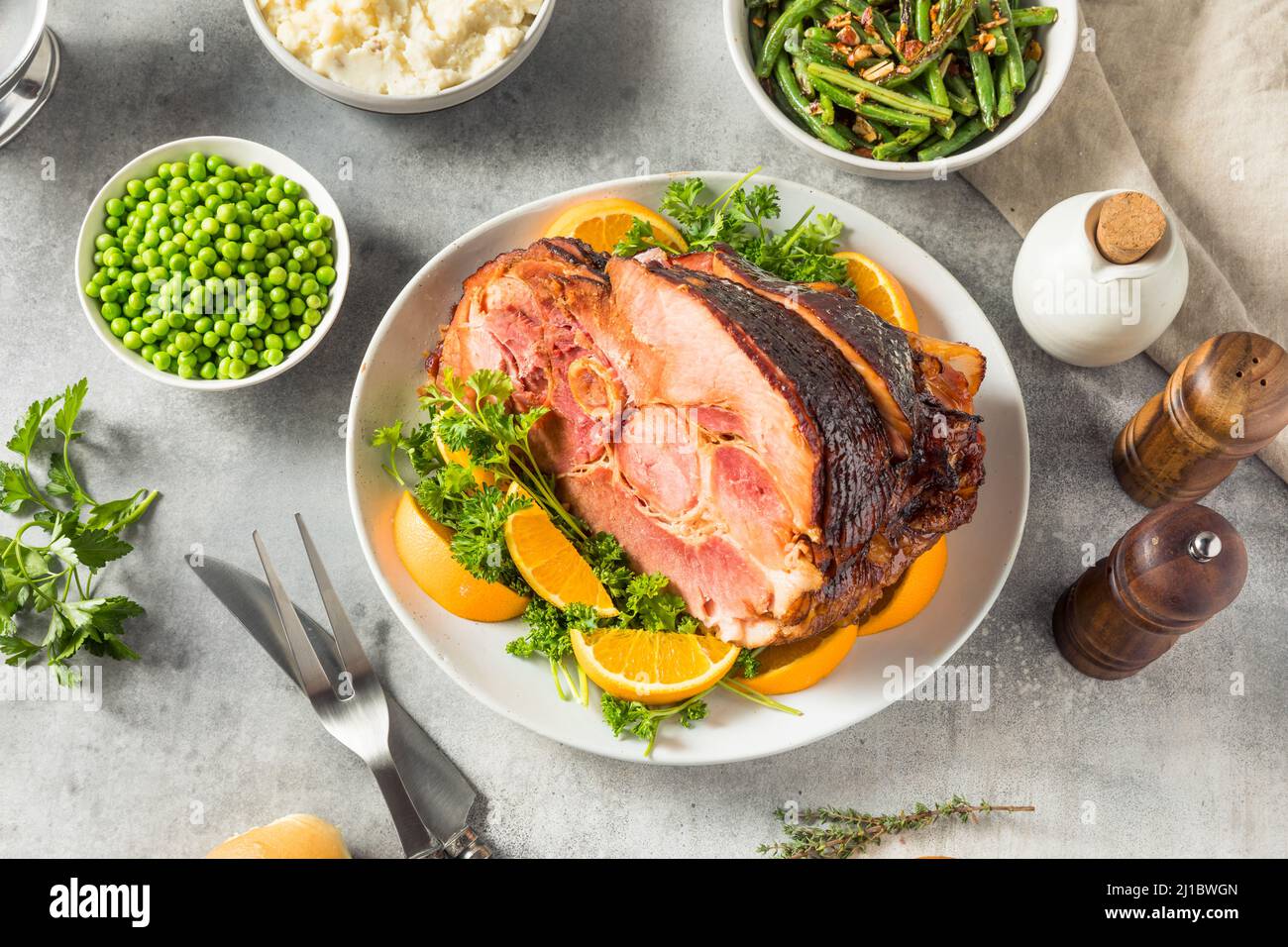 Homemade Easter Ham Dinner with Pototoes Beans and Peas Stock Photo - Alamy