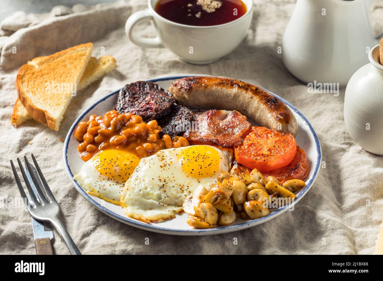 Homemade Full English Breakast with Eggs Sausage Ham and Beans Stock ...