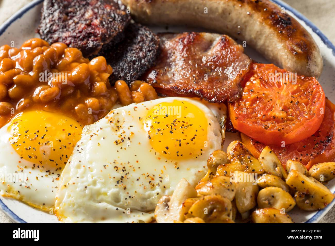 Homemade Full English Breakast with Eggs Sausage Ham and Beans Stock ...