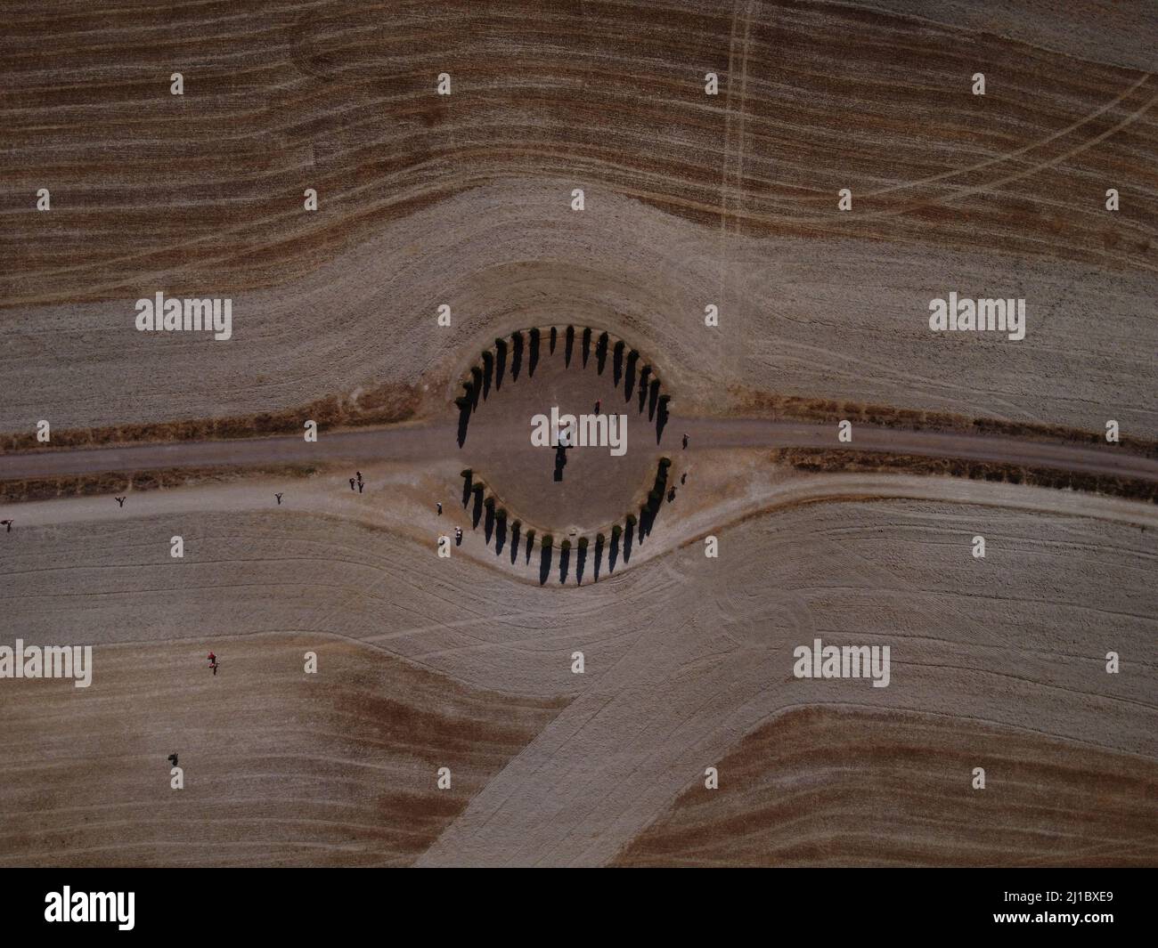 A bird's eye view of an empty crossroad on a landscape of yellow hills in Tuscany, Italy Stock ...