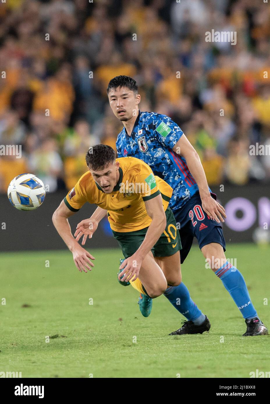 Ajdin Hrustic of Australia is challenged by Yuta Nakayama of Japan ...