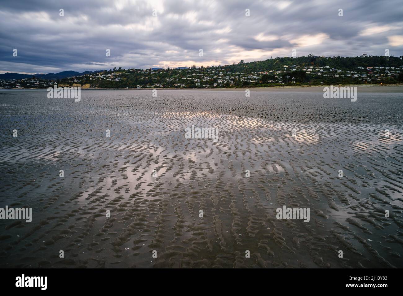 The cloudy sky over the Tahunanui Bay, Nelson, New Zealand Stock Photo ...