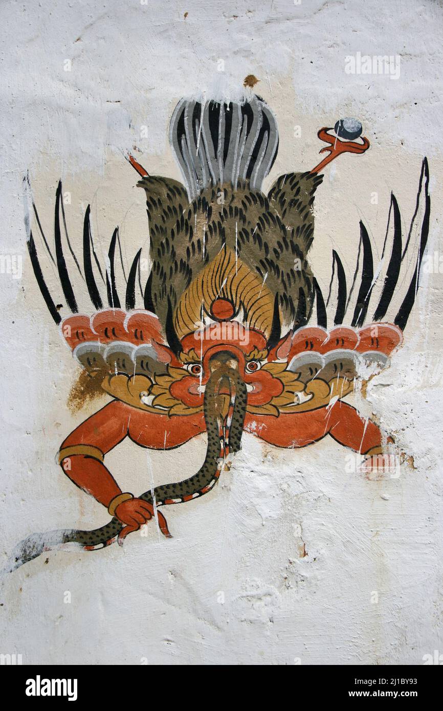 traditional painting of a garuda on the wall of a house in lobesa in ...