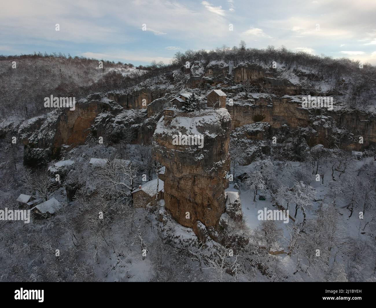 Aerial photo of a monastery on a rock monolith. Katskhi Pillar in ...