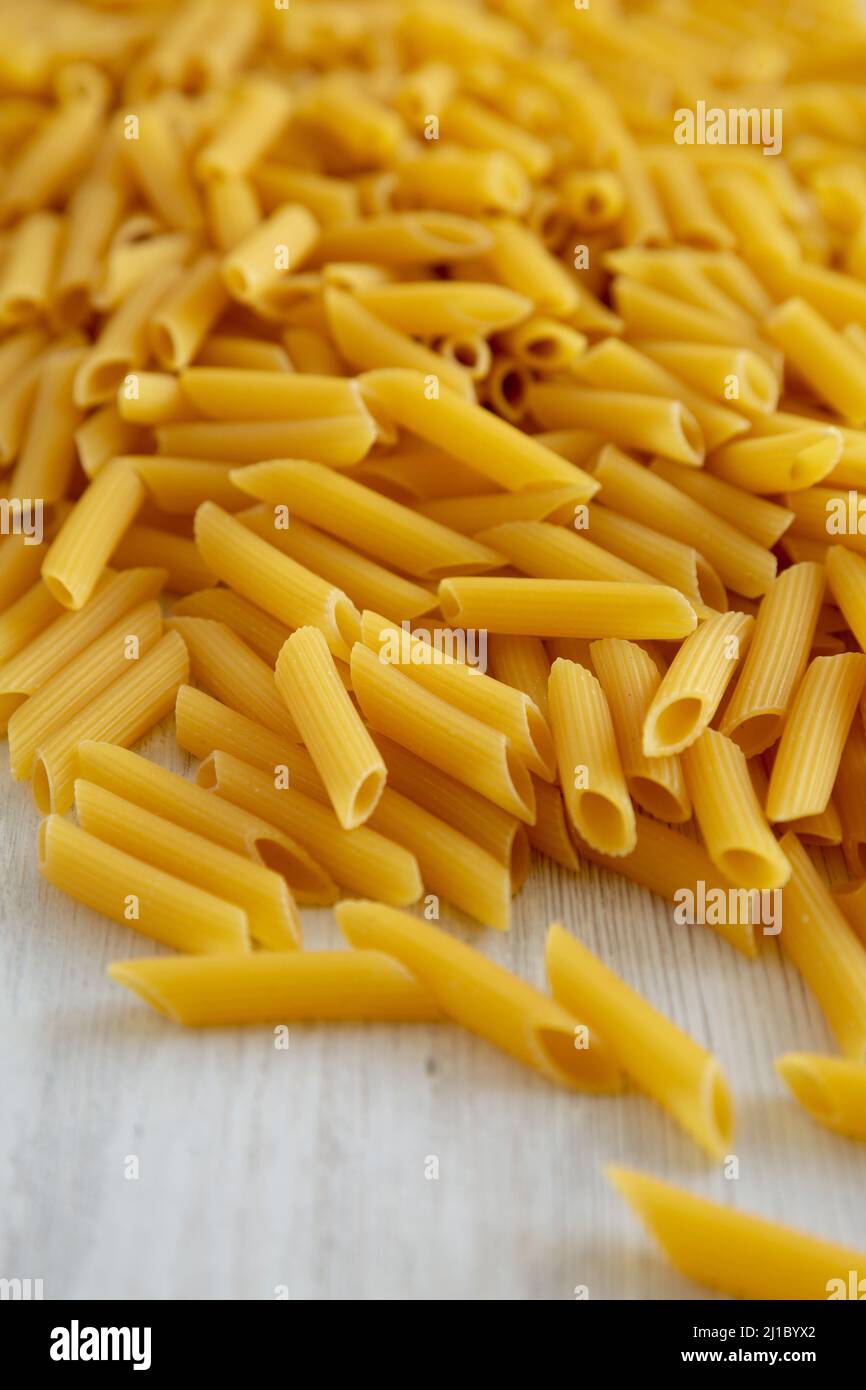 Homemade Raw Dry Penne Pasta, side view Stock Photo - Alamy