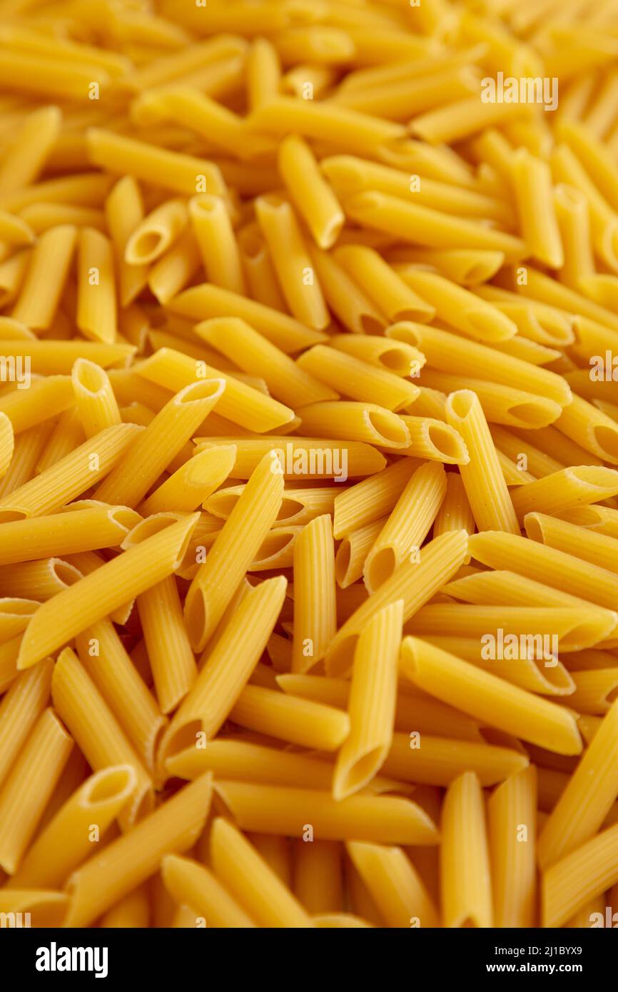 Homemade Raw Dry Penne Pasta, side view Stock Photo - Alamy