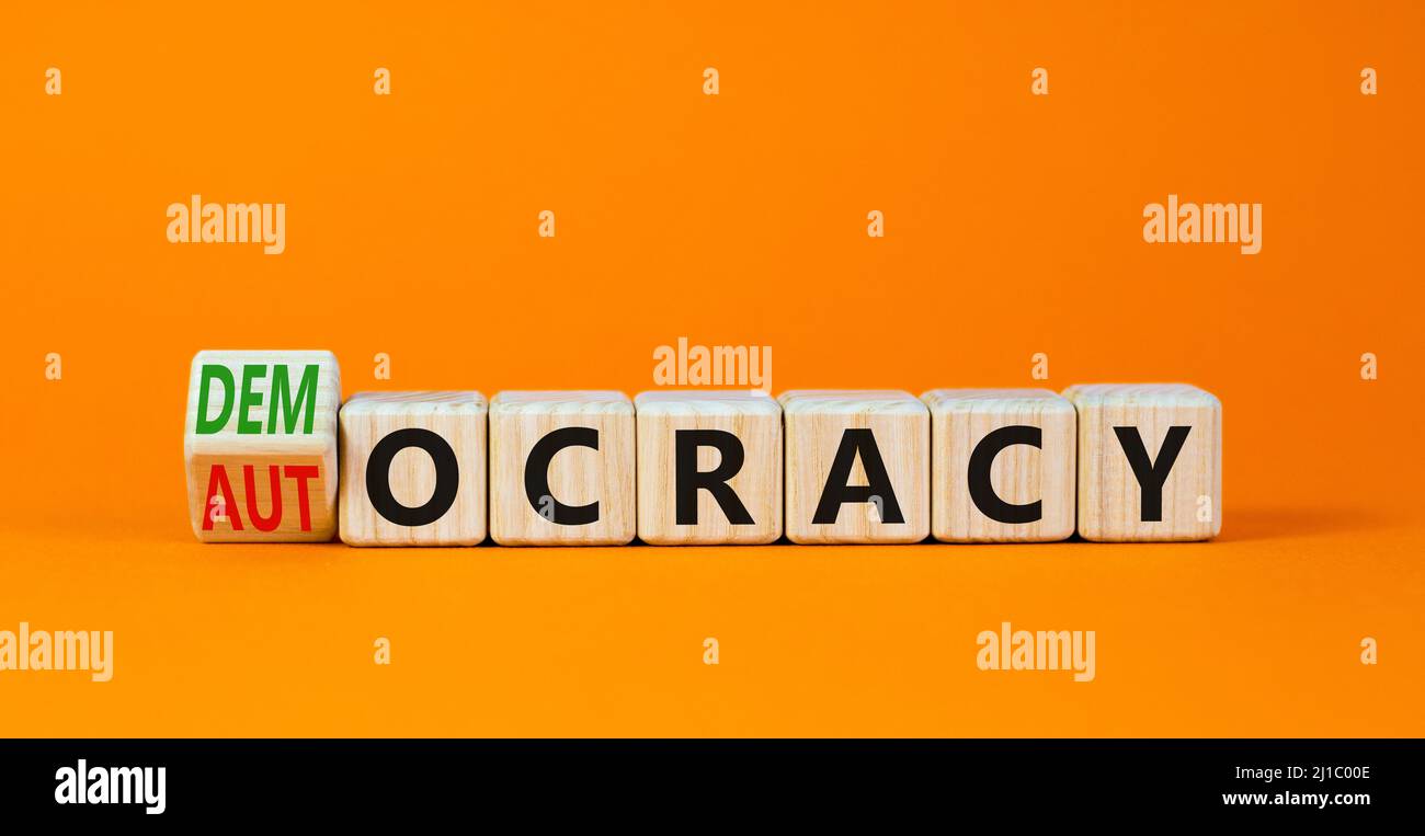 Democracy or autocracy symbol. Turned wooden cubes and changed the ...