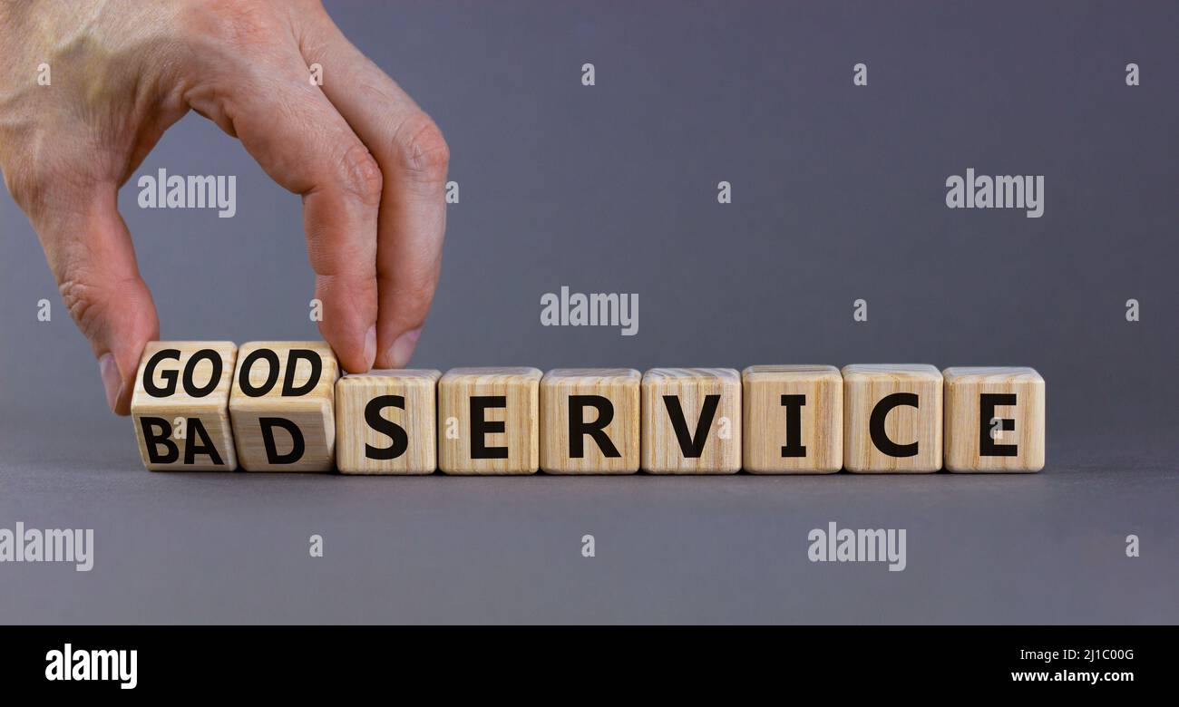 Good or bad service symbol. Businessman turns cubes and changes words ...