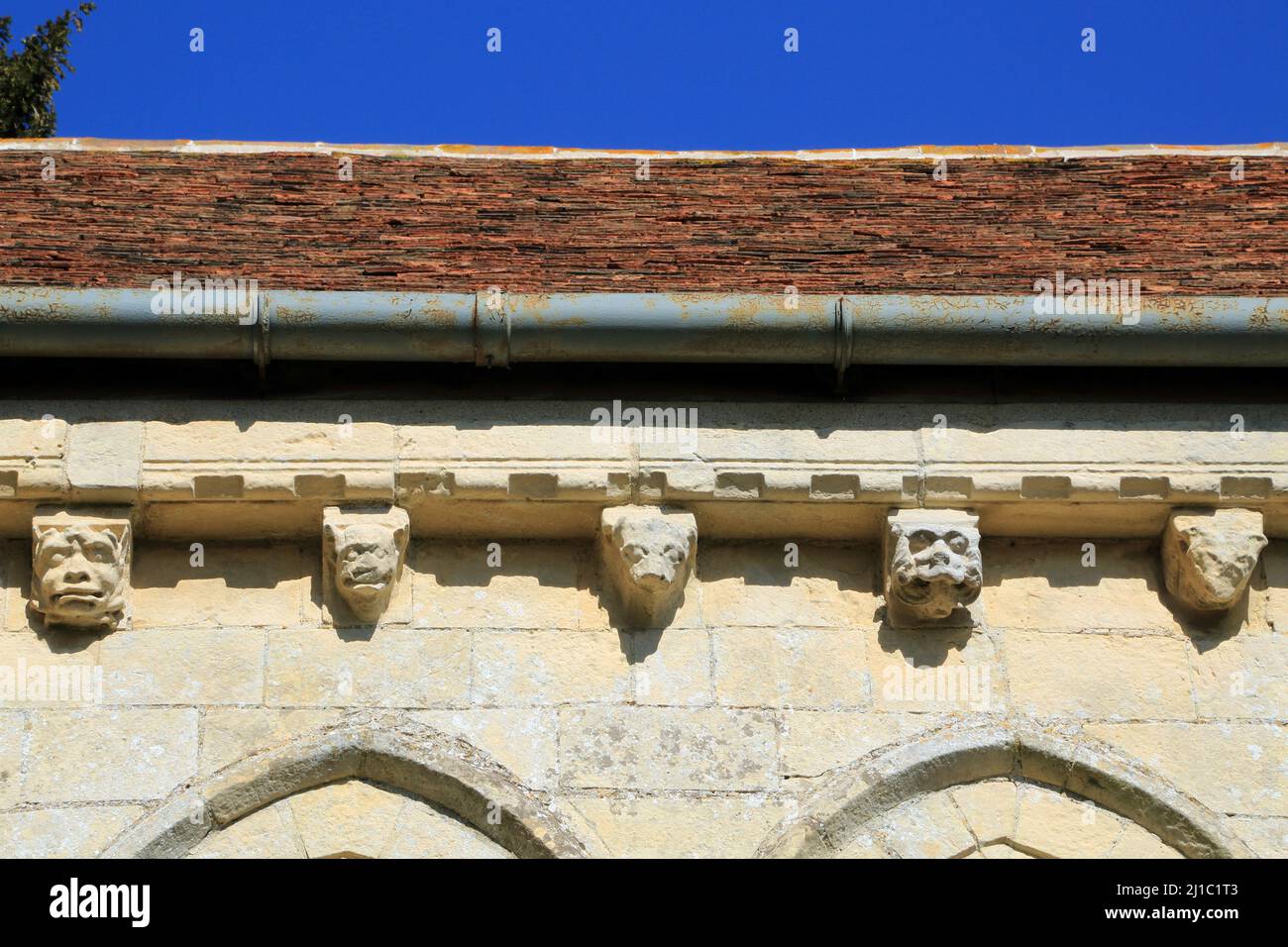 Stone carving below the roof on the Nave of the church of St Nicholas ...