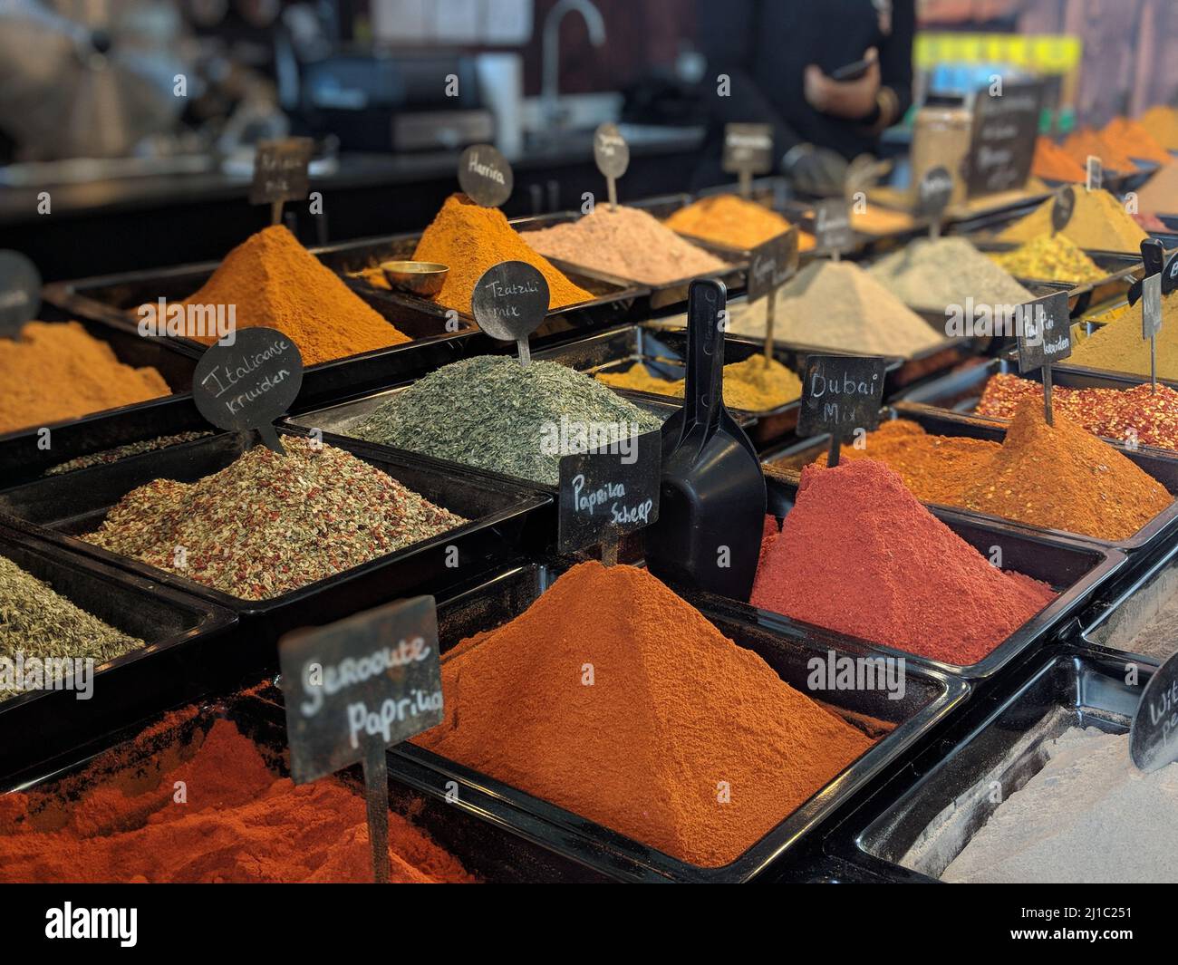 A closeup of different spice piles in a market Stock Photo - Alamy