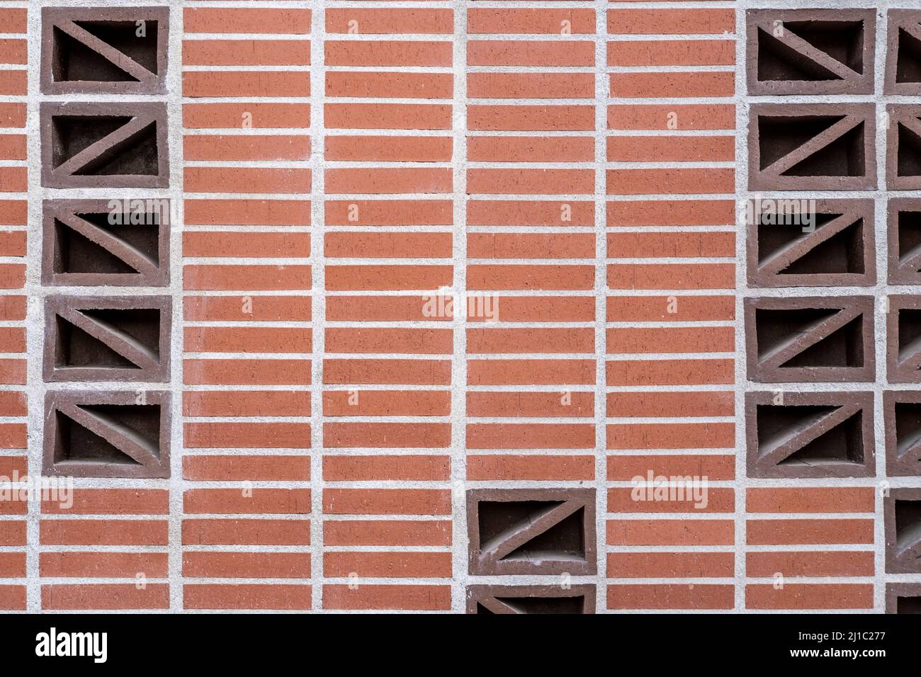 Red brick wall with an original design Stock Photo - Alamy