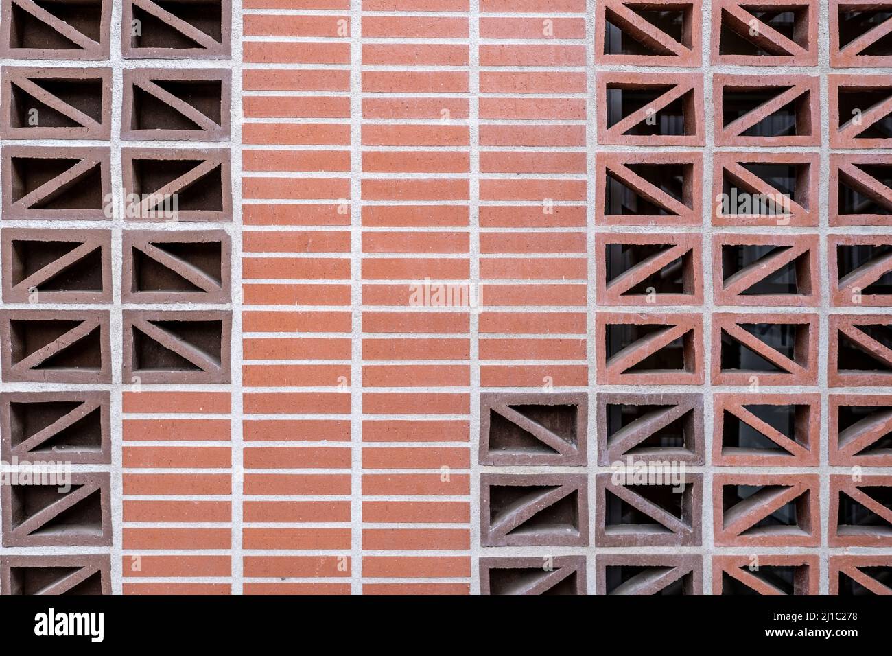 Red brick wall with an original design Stock Photo - Alamy