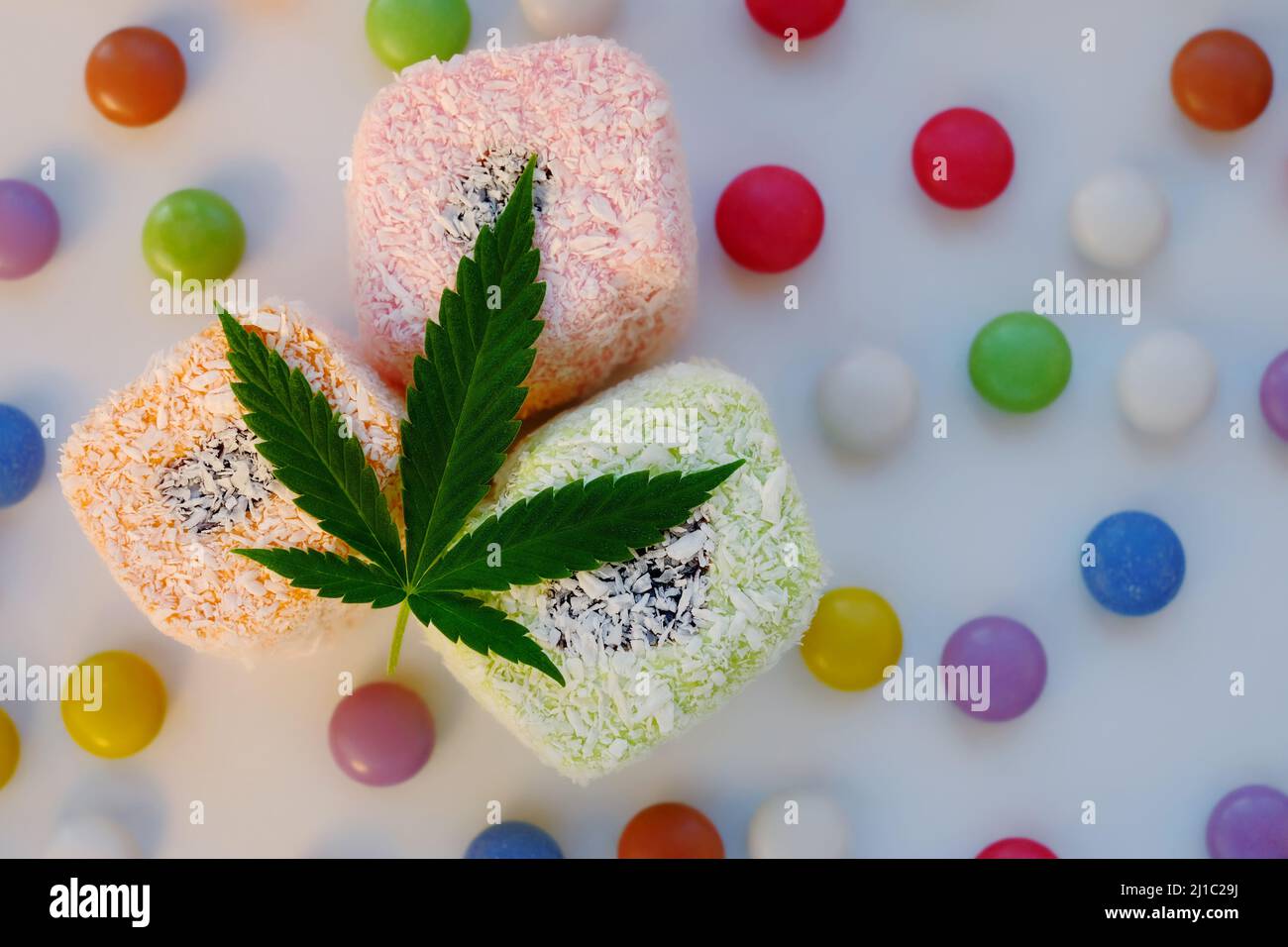 Cannabis leaf with Turkish delight and colorful candy confetti with ...
