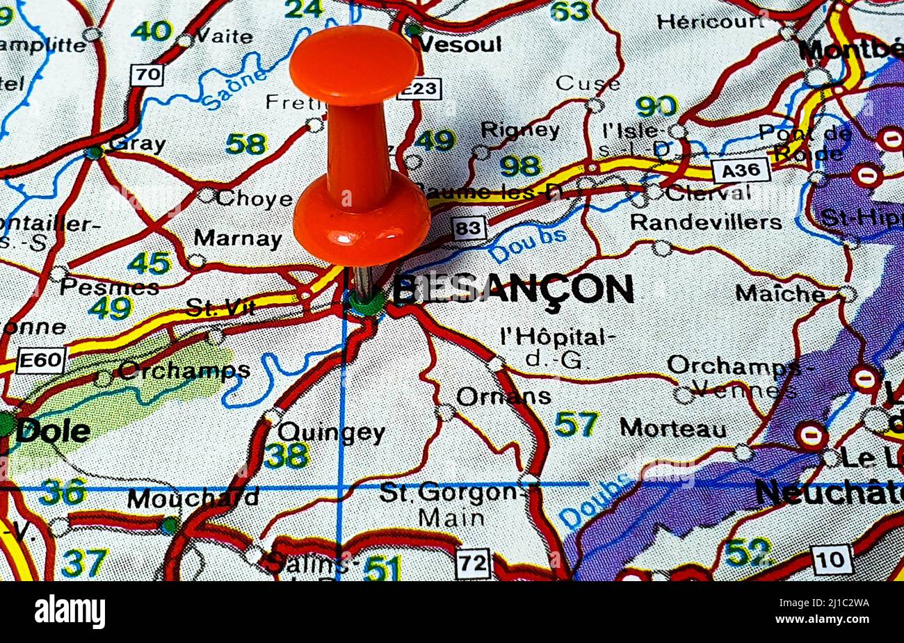 A red pin marking the location of Besancon, France on a colorful map ...