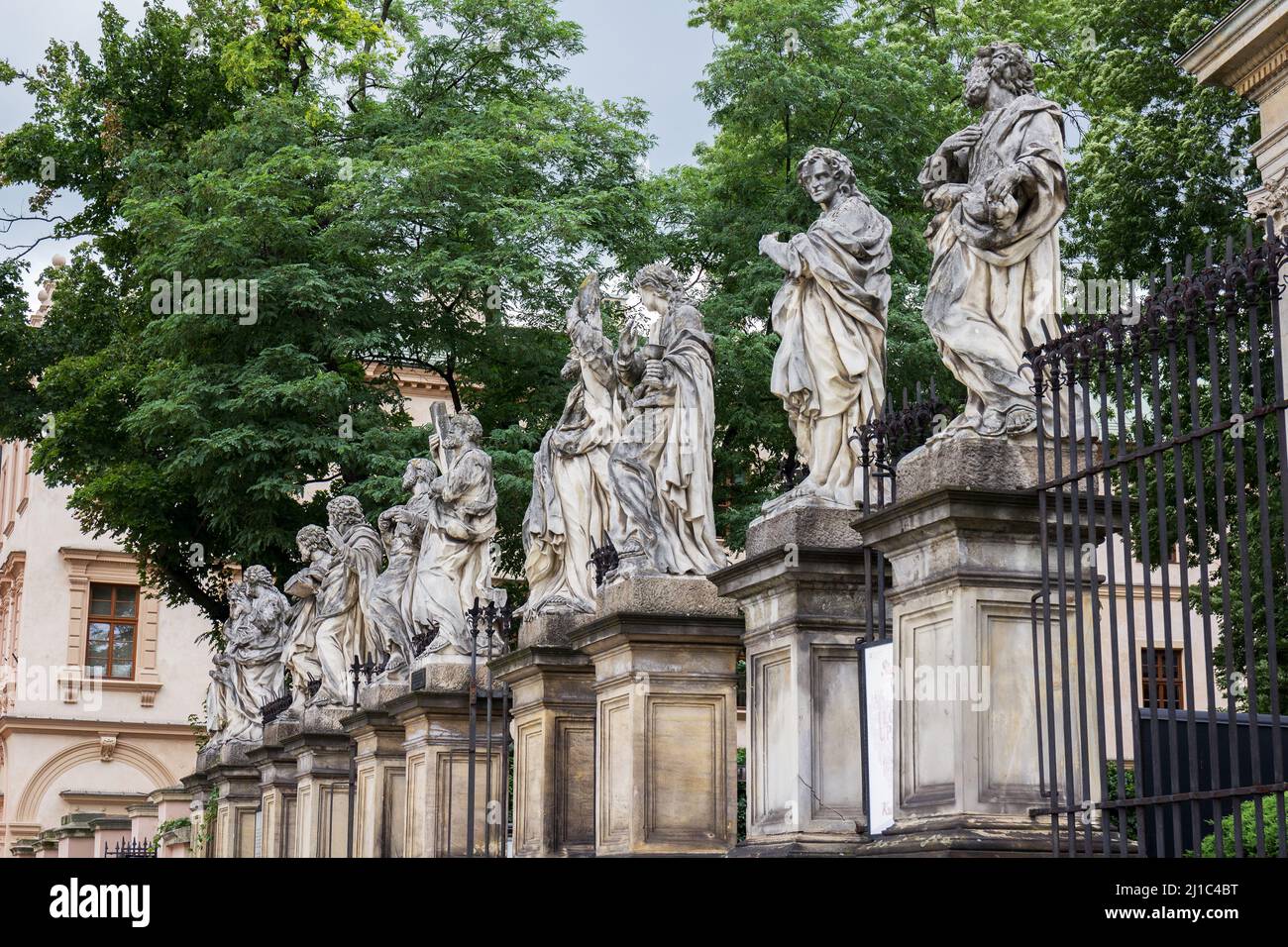 Stone statue of apostles in the front of Church of St.Paul and St Peter in old town center ...