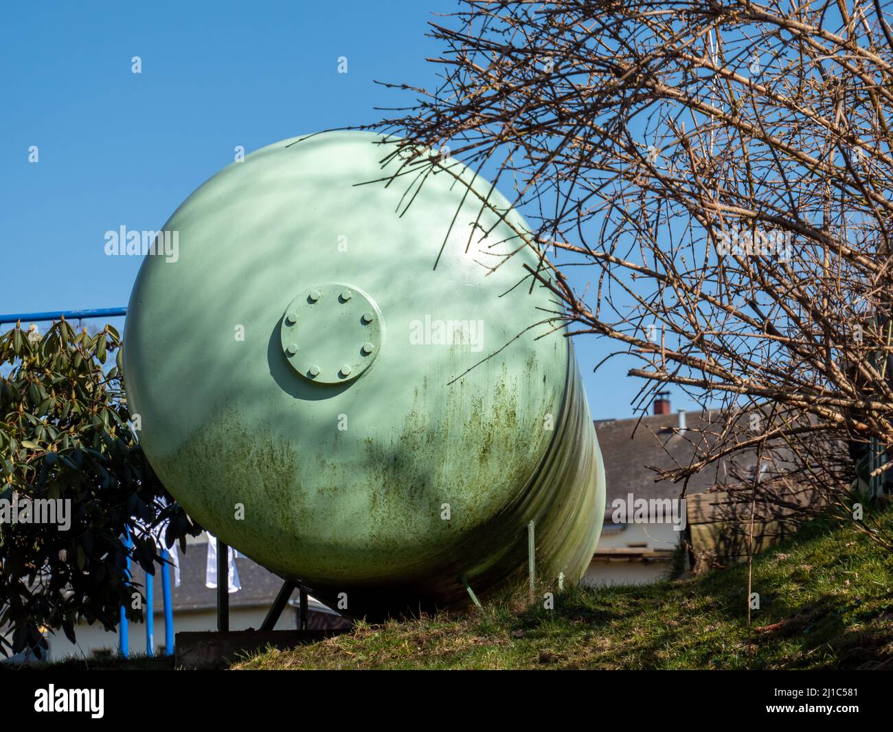 Fuel gas tank at the house Stock Photo - Alamy