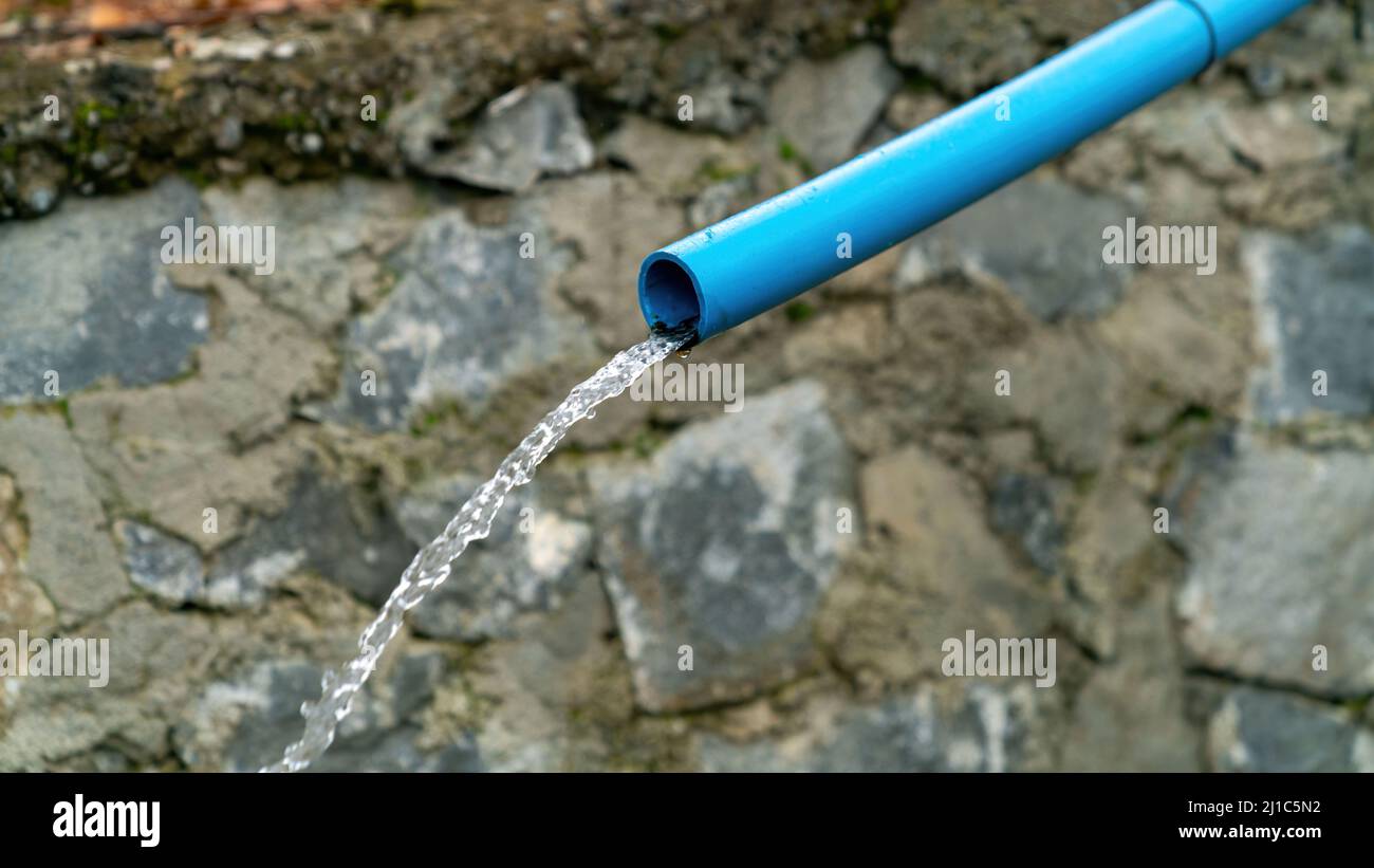 Water running from a blue water pipe, equipment agriculture Stock Photo ...