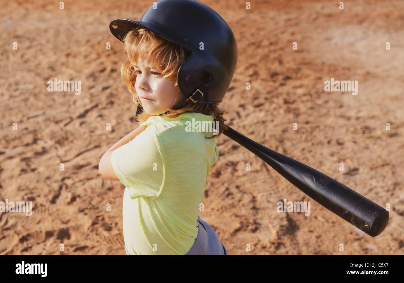 Boy in baseball helmet and baseball bat ready to bat Stock Photo - Alamy
