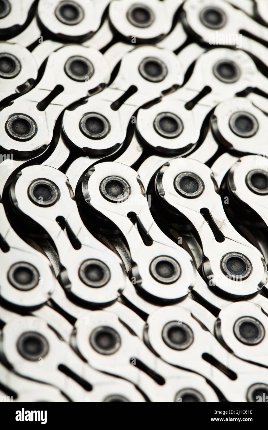 Patterns of a technological bicycle chain braided in a circle with blue ...
