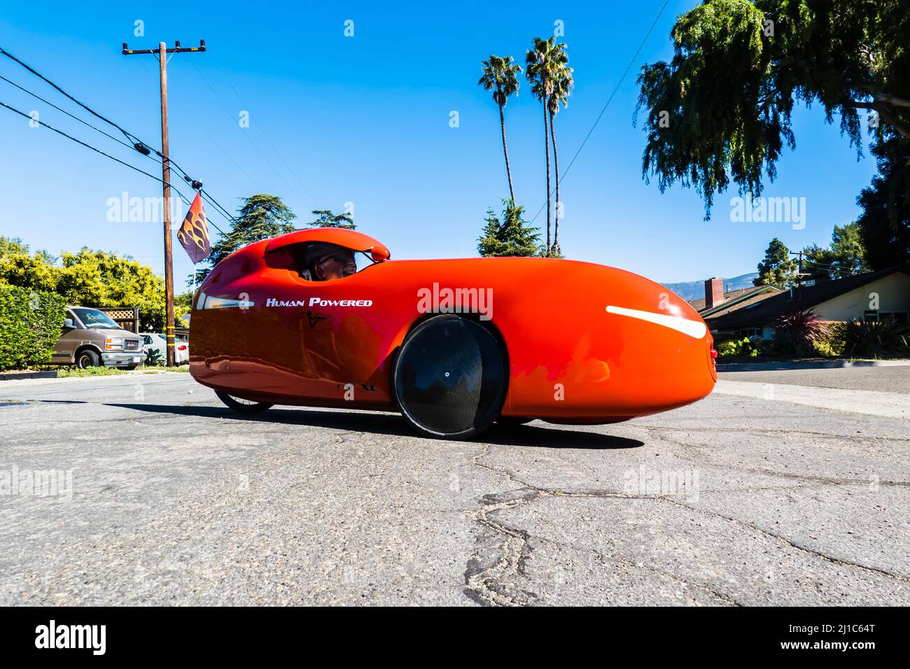 A velomobile three-wheeled recumbent bike that has the rider in a laid ...
