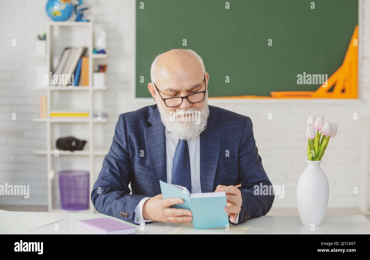 Senior professor at school. Man teacher with beard in class Stock Photo ...
