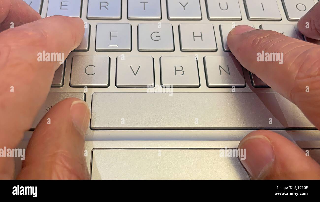 a photo of Computer use, laptop keyboard and close up hands Stock Photo ...