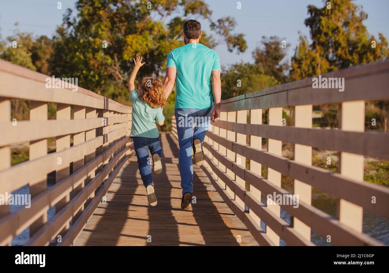 Back view portrait of happy father and son Stock Photo - Alamy