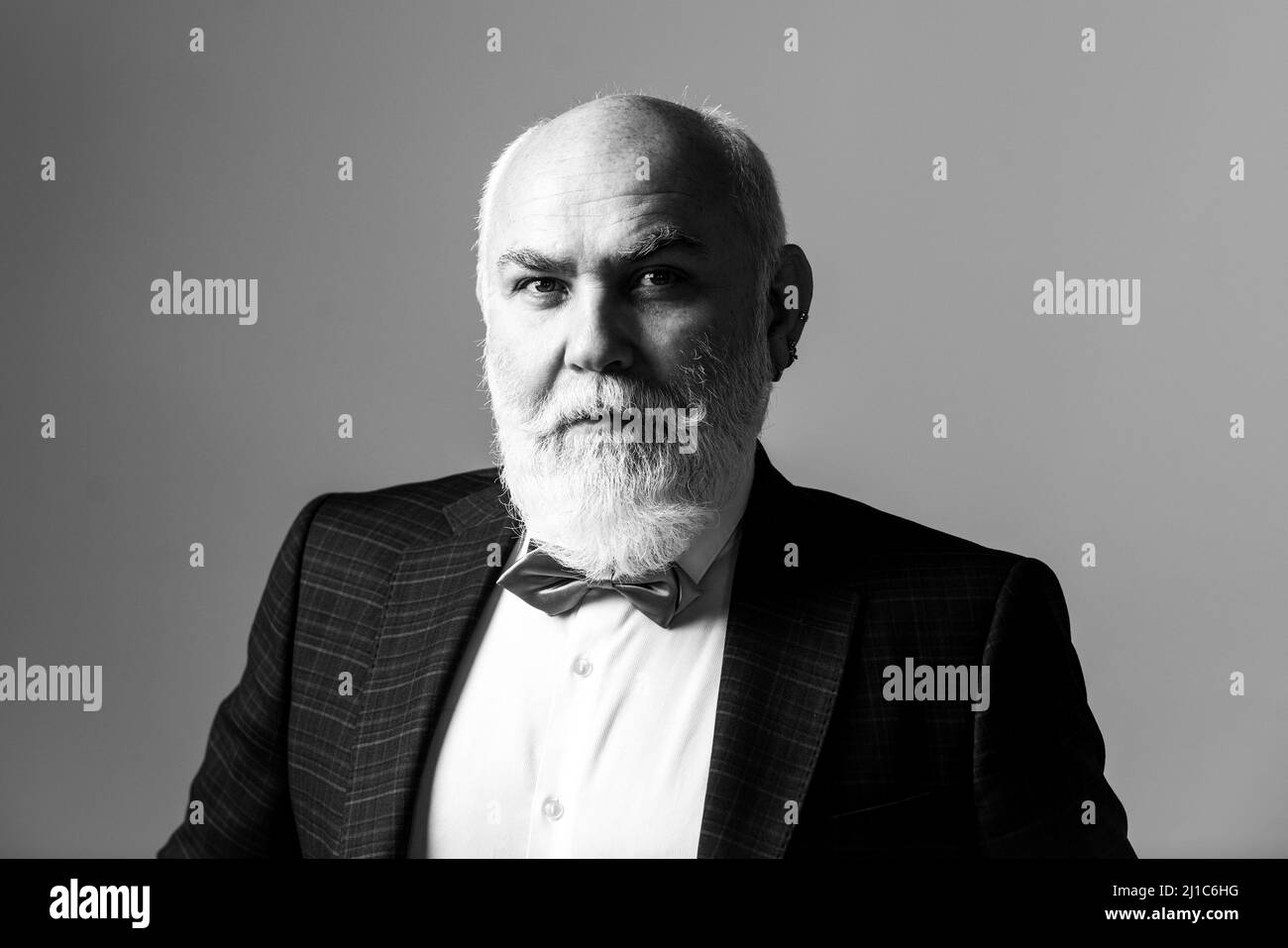 Senior male. 60 year old man. Satisfied mature businessman looking at ...