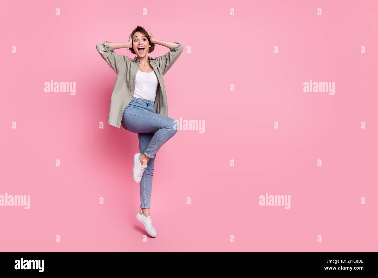 Full body portrait of impressed cheerful lady hands on head open mouth ...