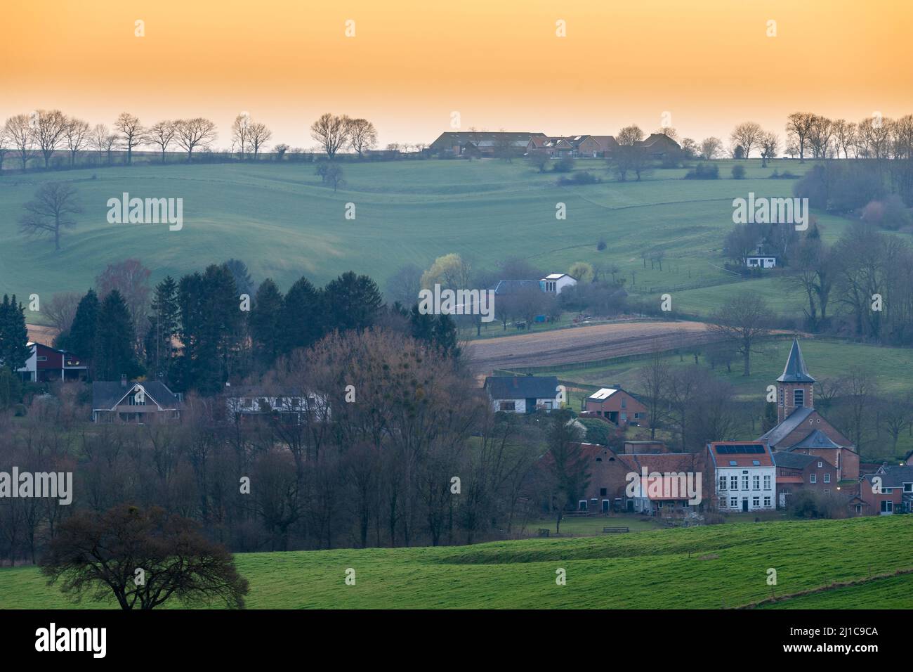 A sunset during spring over het rolling hill landscape in the south of ...
