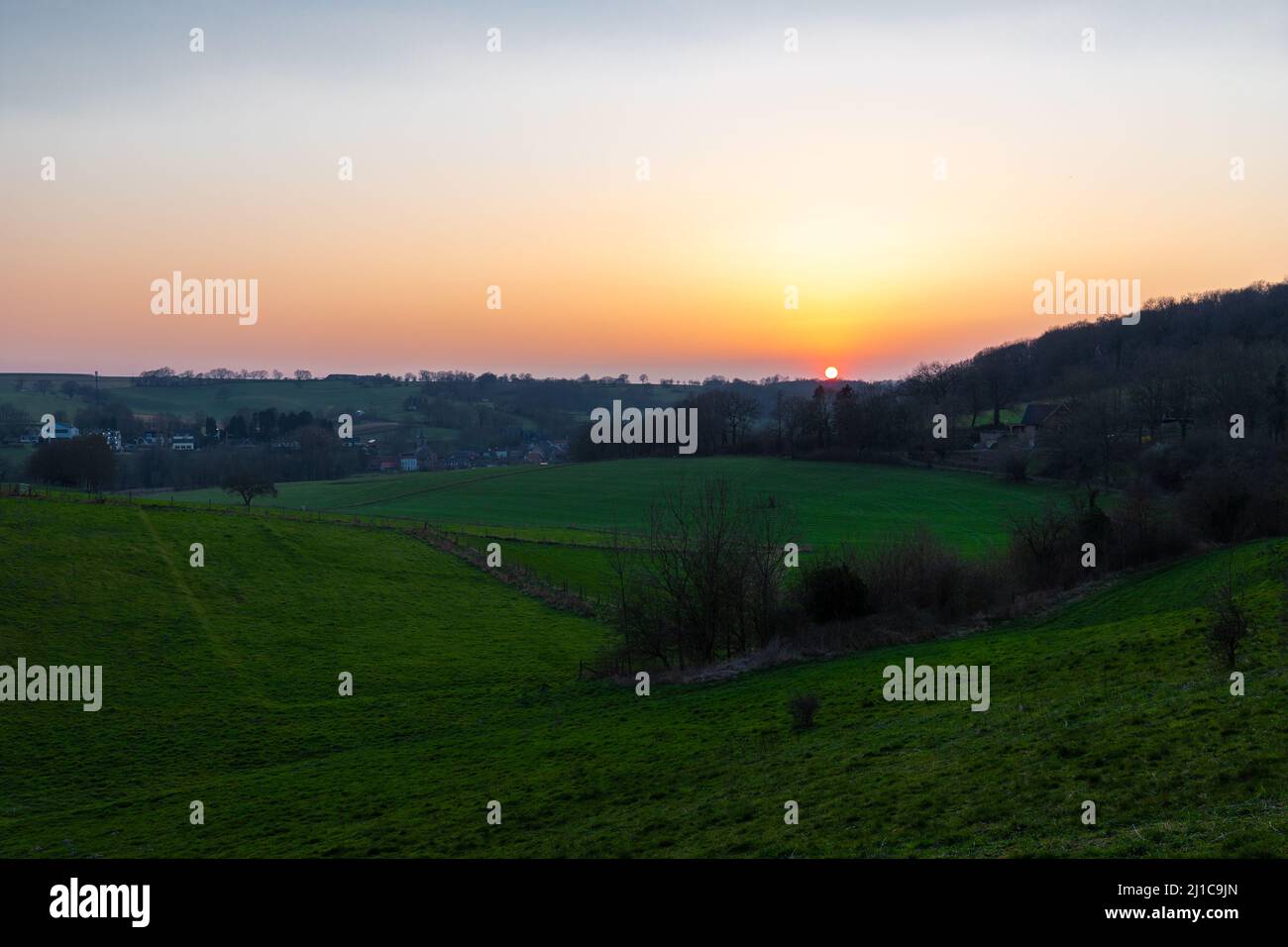A sunset during spring over het rolling hill landscape in the south of ...
